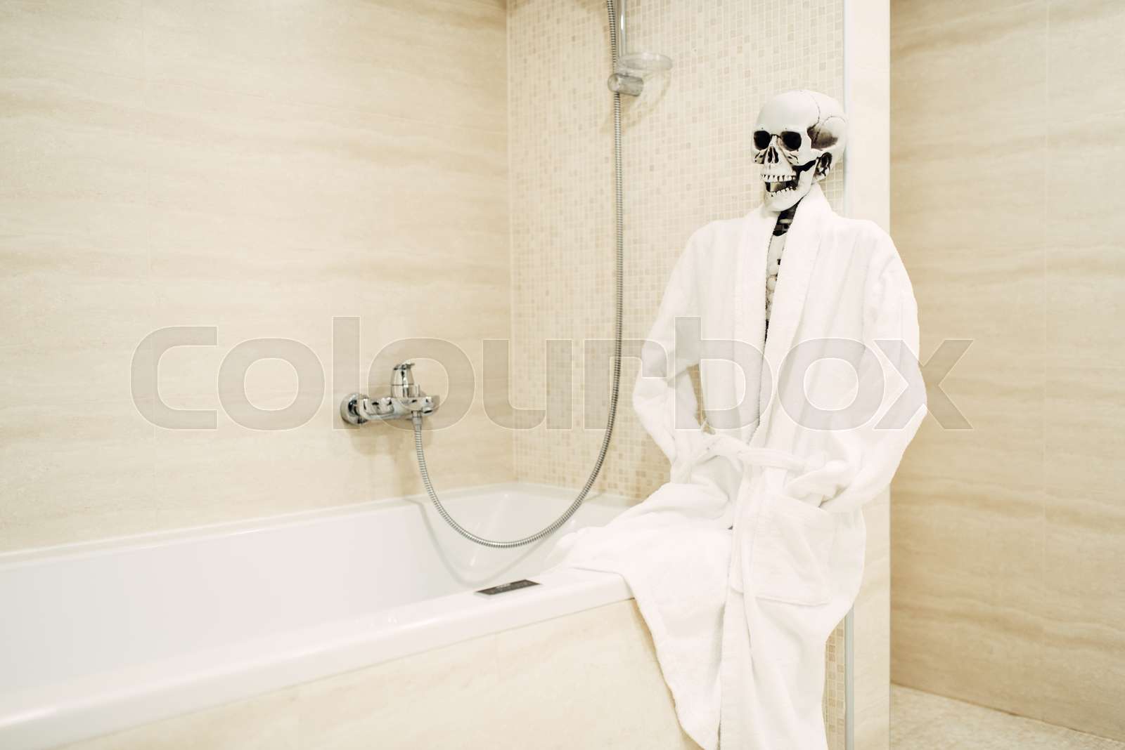 Human skeleton sitting on the edge of the bath | Stock image | Colourbox