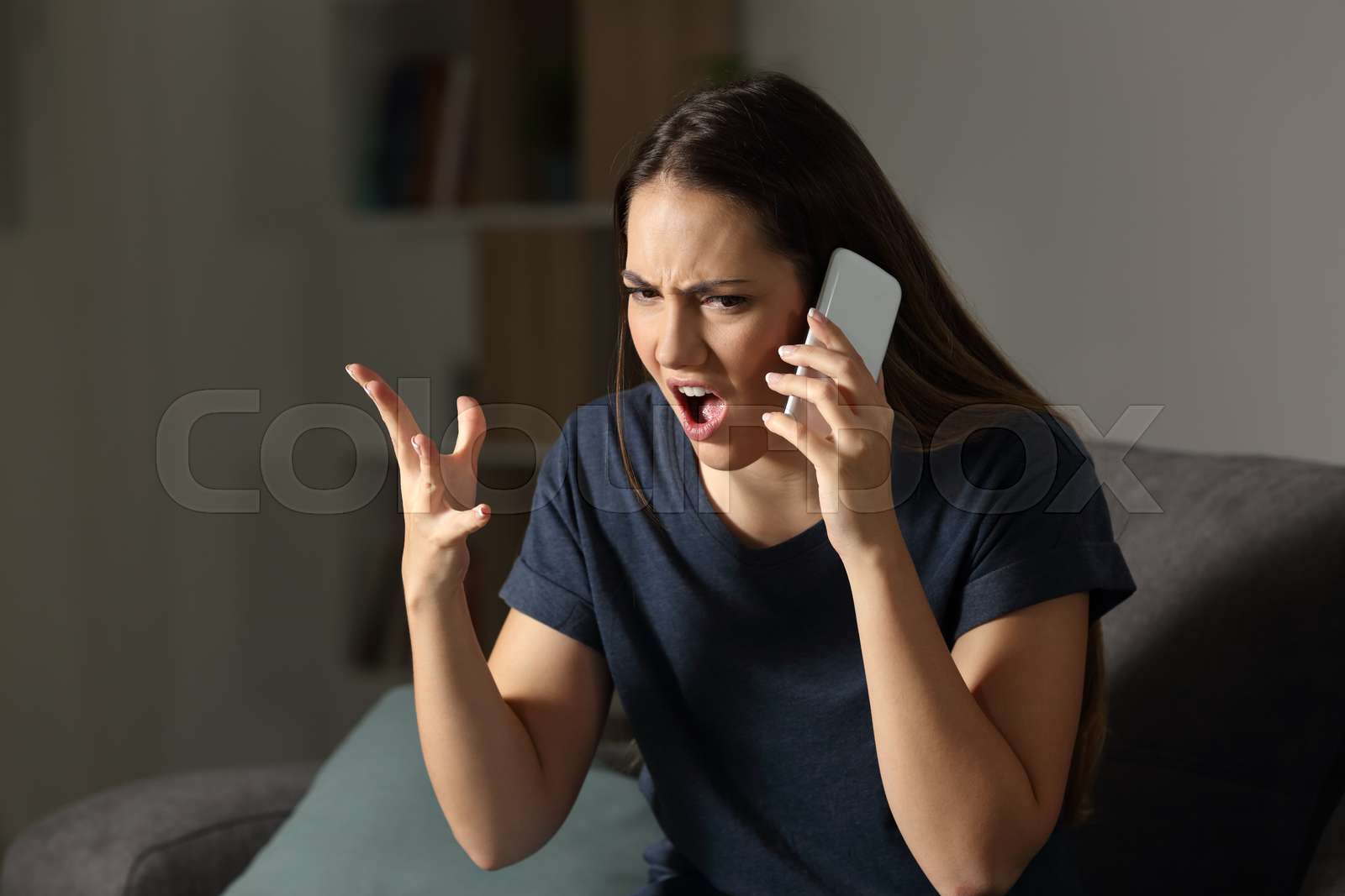 Angry customer claiming on the phone | Stock image | Colourbox