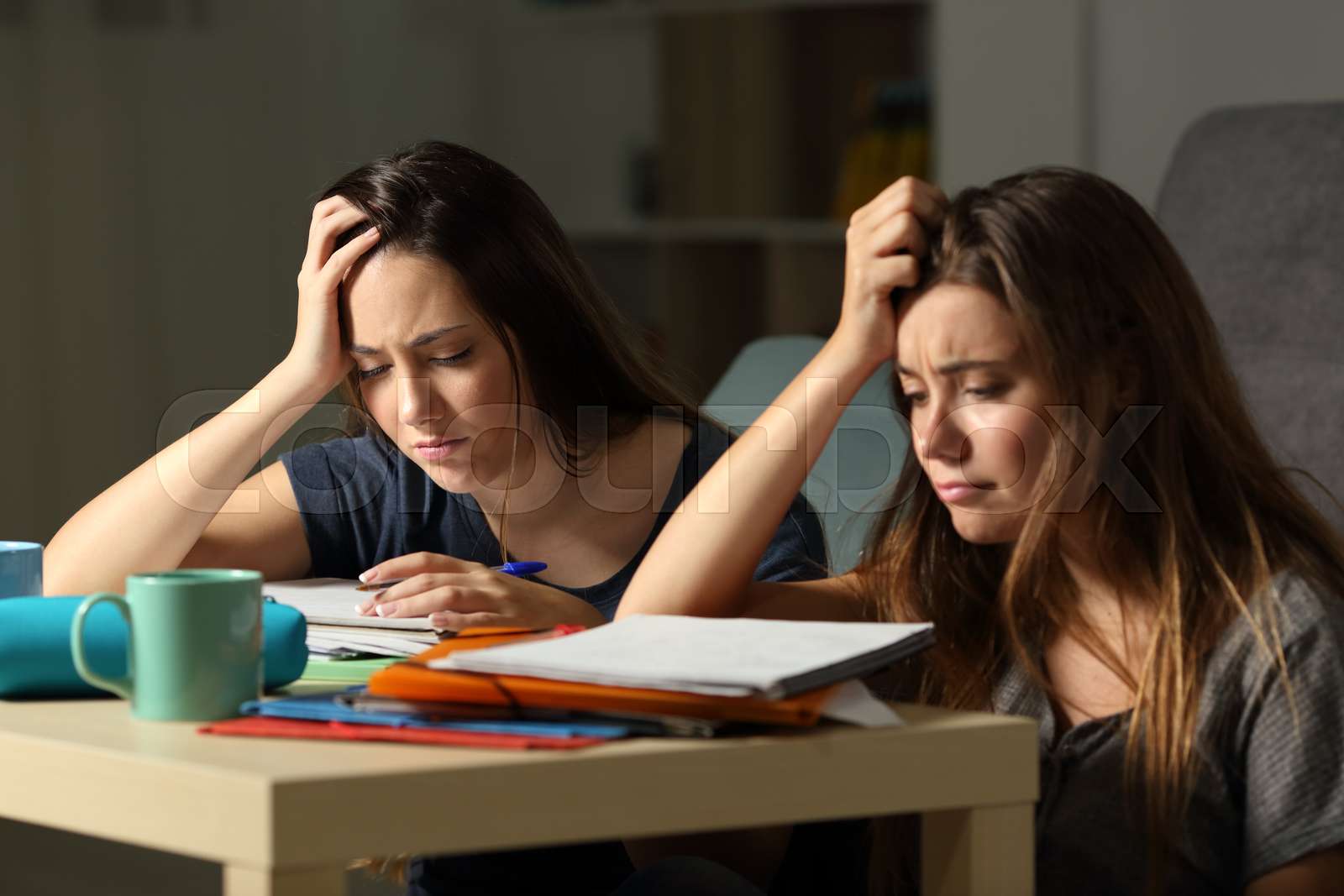 Frustrated students studying late hours in the night | Stock image ...