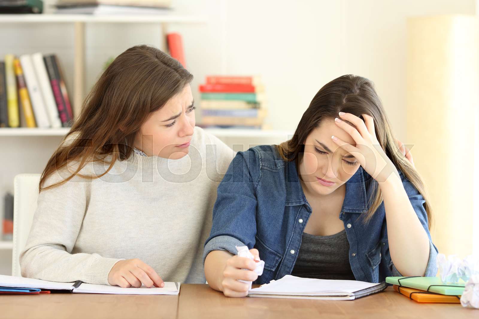 Student comforting her frustrated friend | Stock image | Colourbox