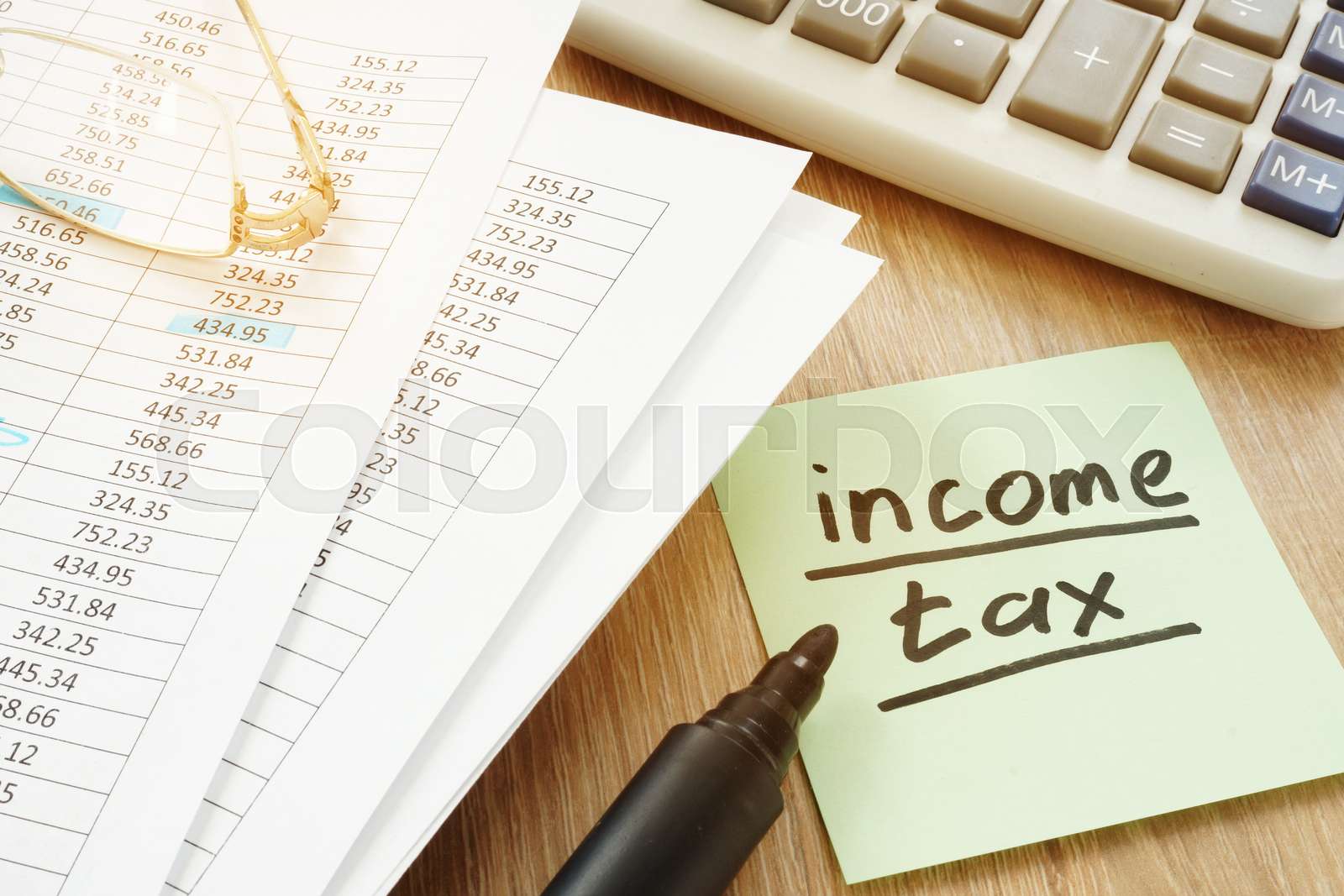 Income tax sign and financial report. | Stock image | Colourbox