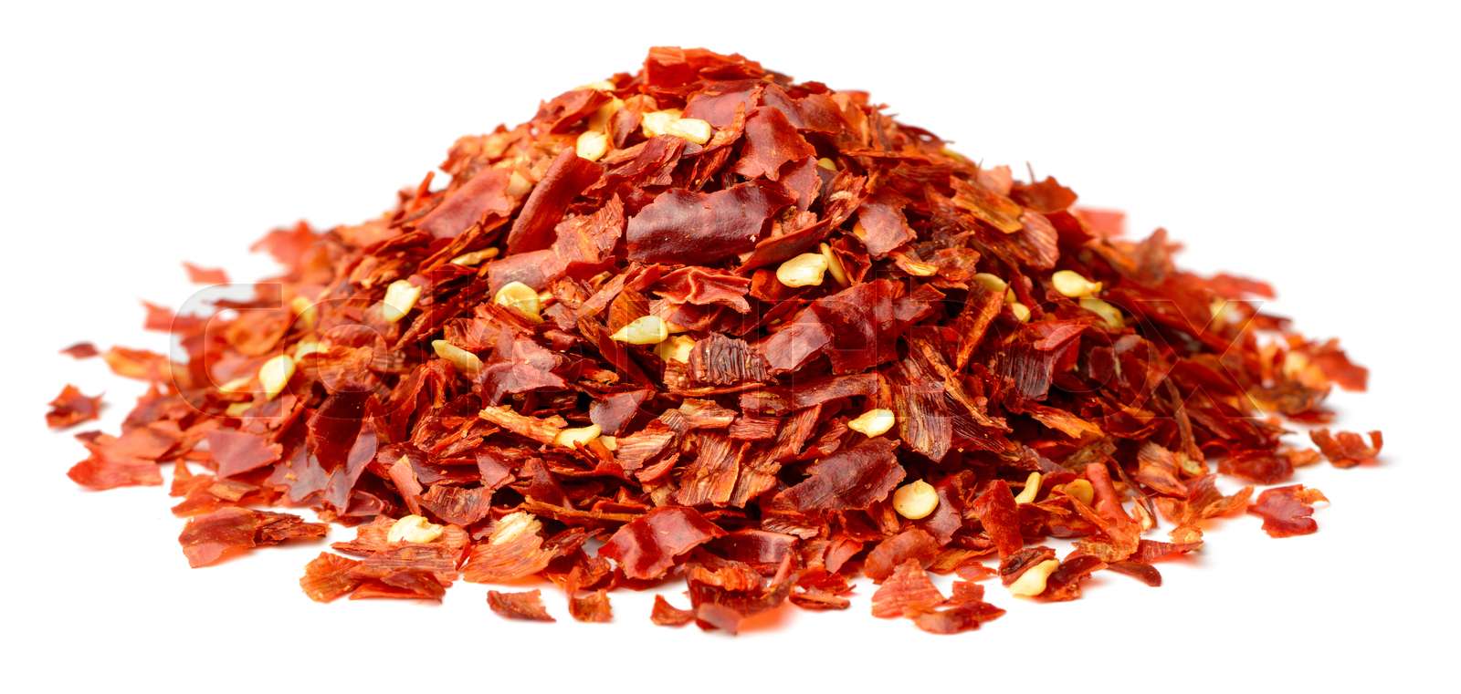 dried red pepper flakes isolated on white | Stock image | Colourbox
