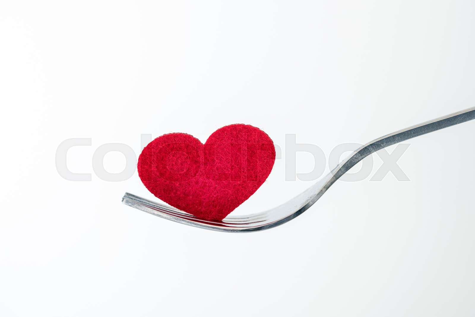 the red heart shape in silver fork , romance love dinning or health ...