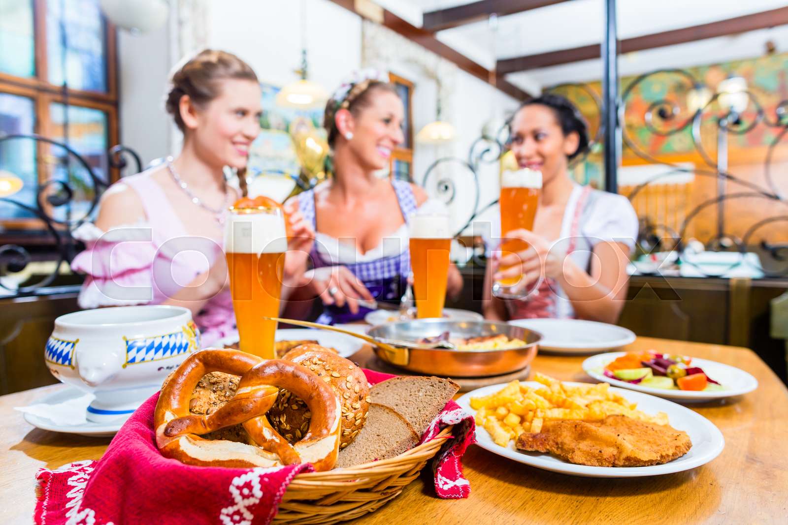 Women eating lunch in Bavarian Restaurant | Stock image | Colourbox