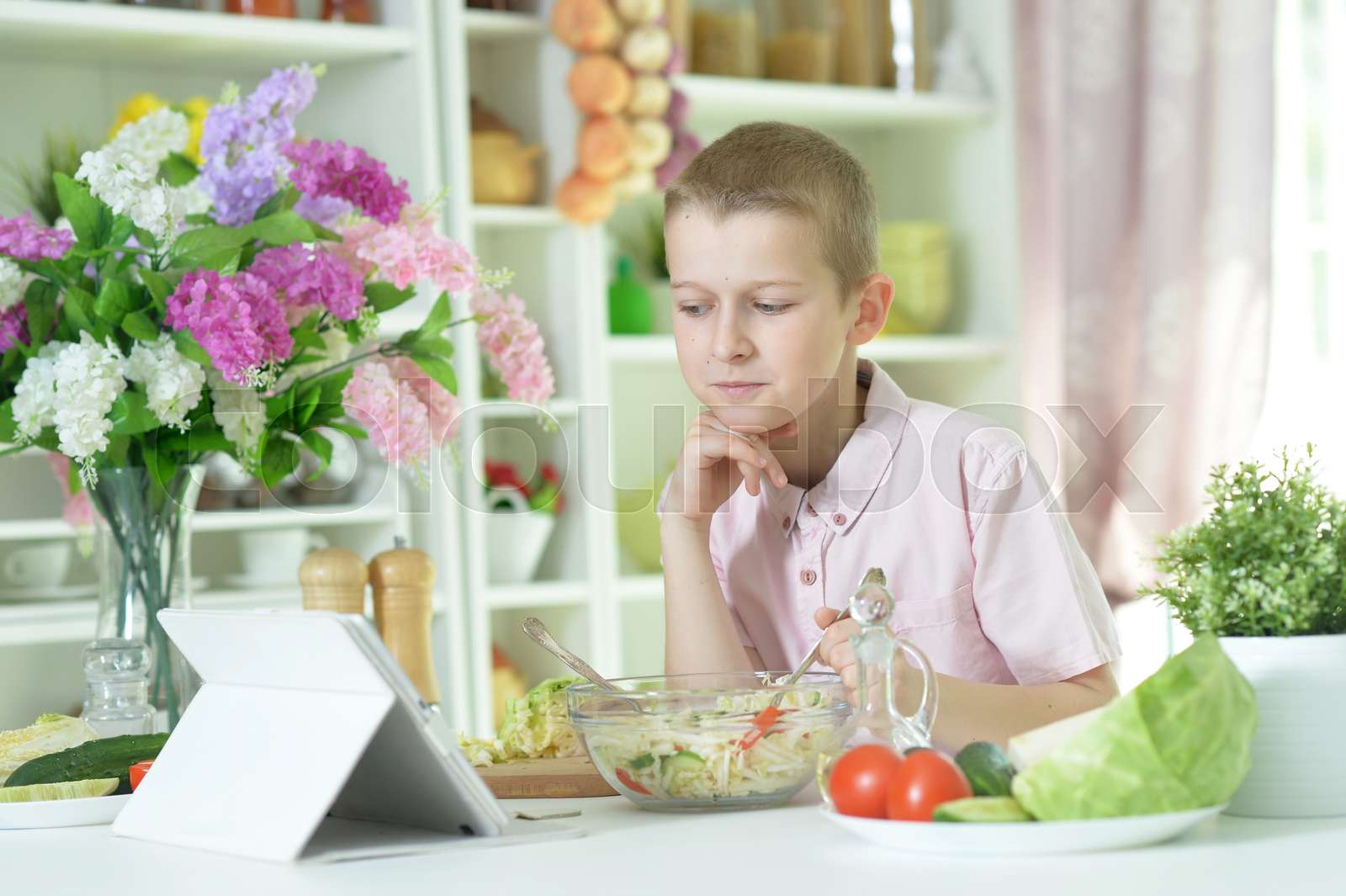 Cute little boy making dinner | Stock image | Colourbox