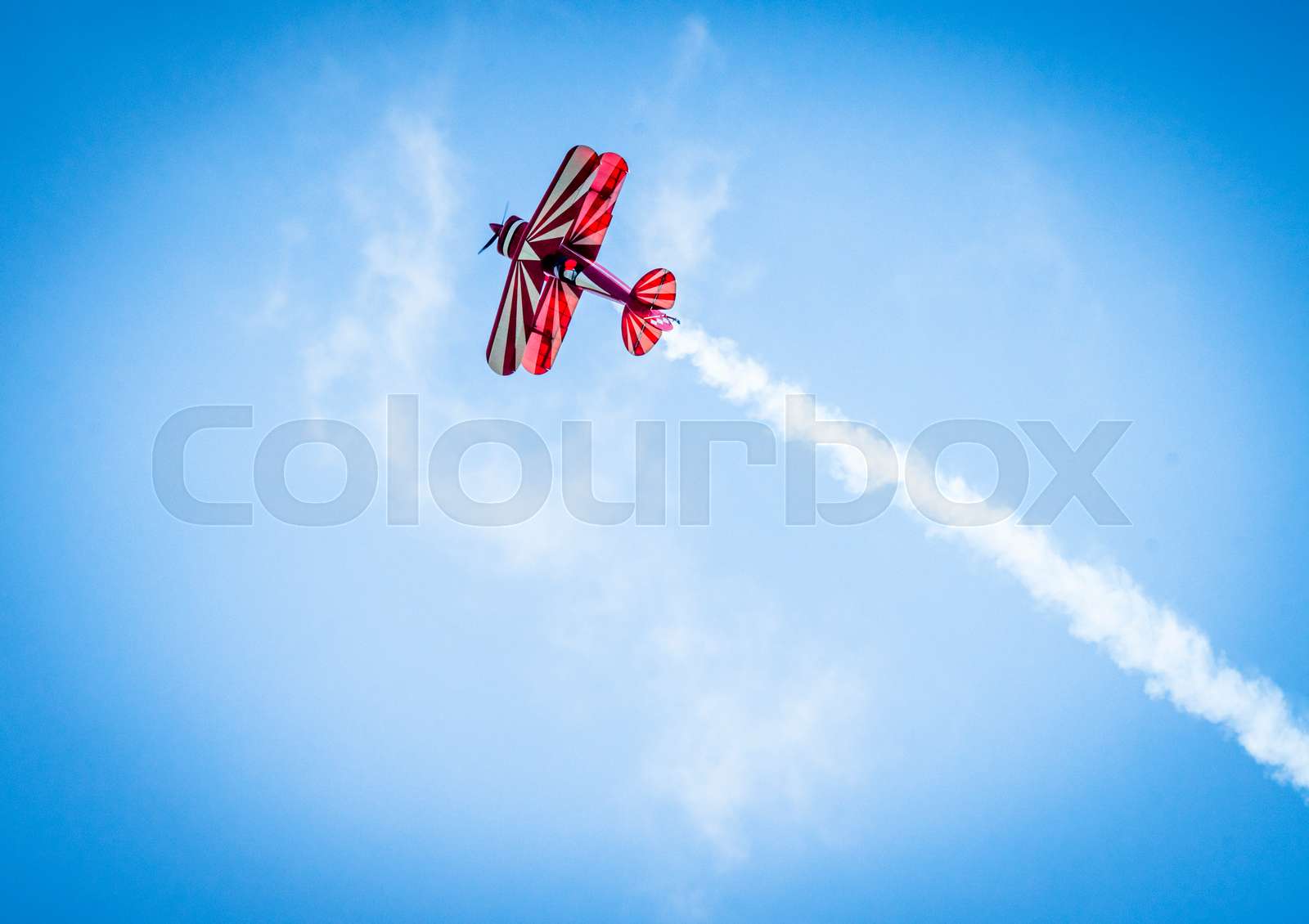 Red plane with propeller flying upward | Stock image | Colourbox