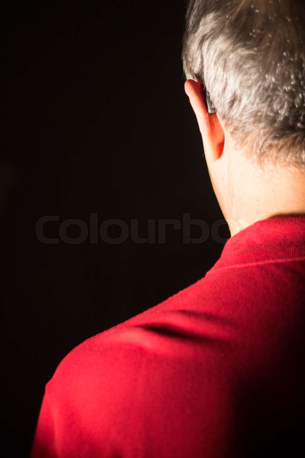 Deaf man hearing aid ear | Stock image | Colourbox