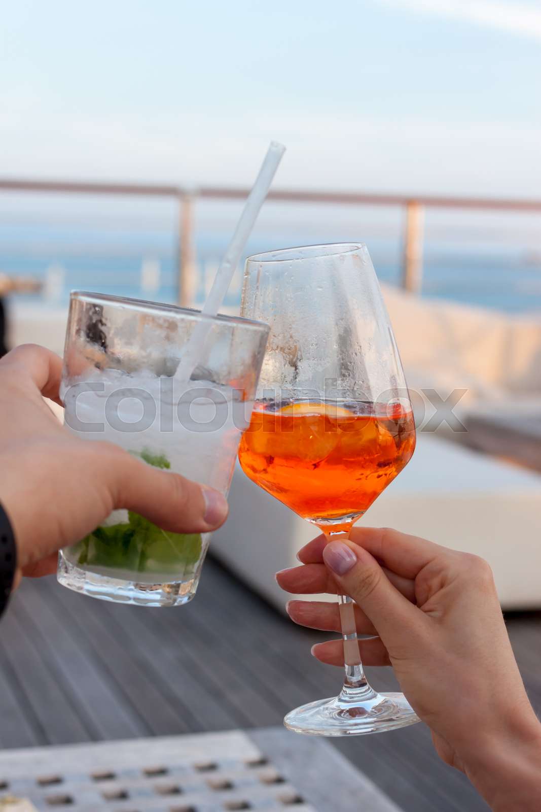 cheers two glasses with cocktails | Stock image | Colourbox