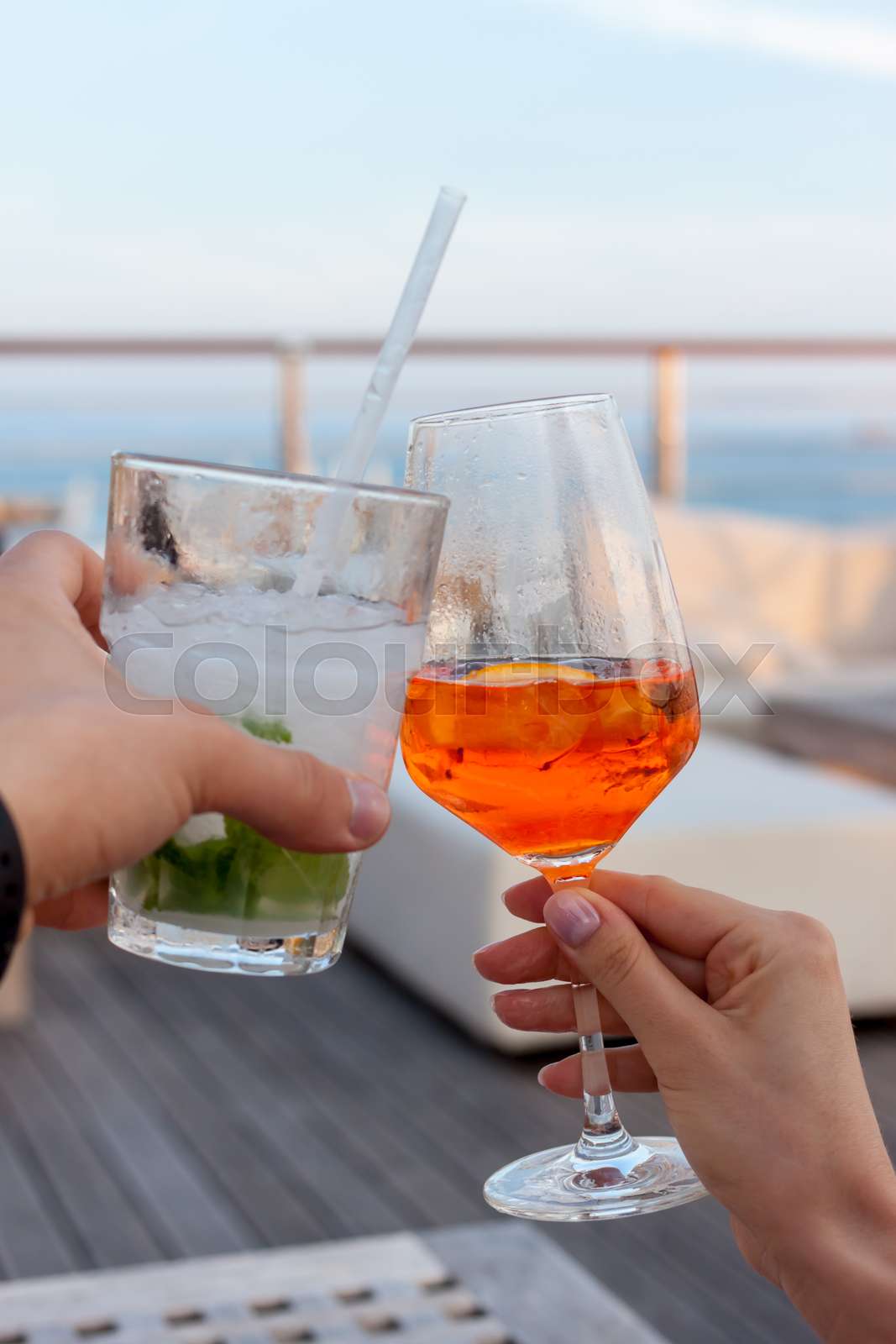 cheers two glasses with cocktails | Stock image | Colourbox