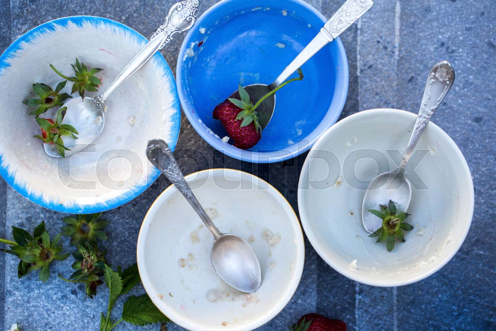 Empty plates after a family breakfast | Stock image | Colourbox