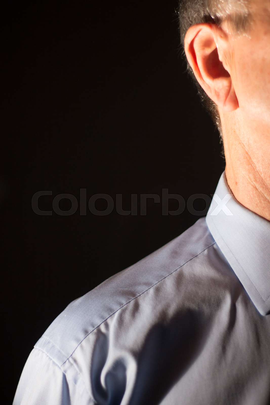 Deaf man hearing aid ear | Stock image | Colourbox