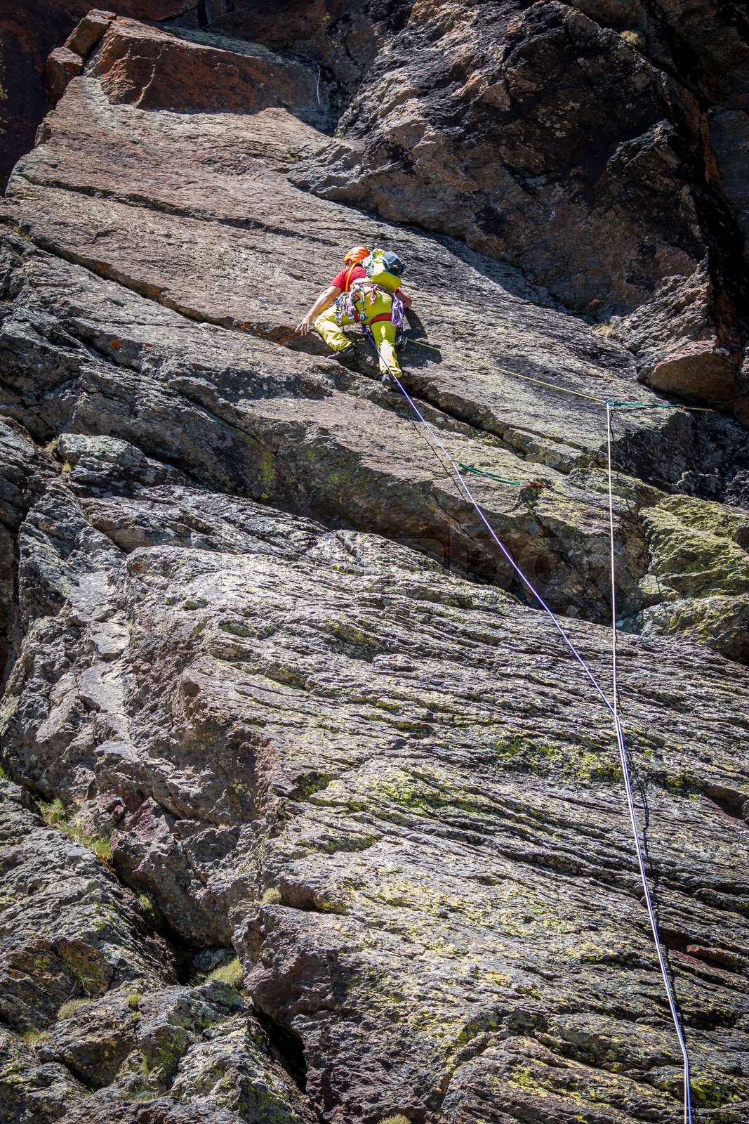 Man climbing high mountain | Stock image | Colourbox