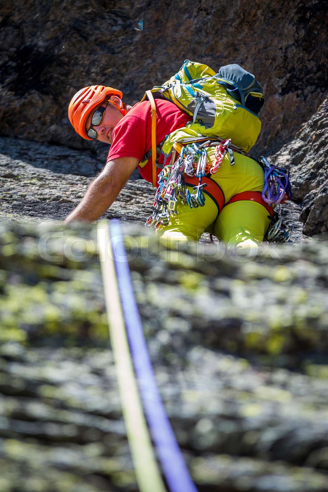 Climber looking down on mountain | Stock image | Colourbox