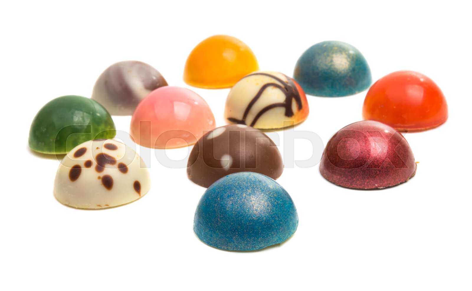 chocolate candy in colored glaze isolated | Stock image | Colourbox