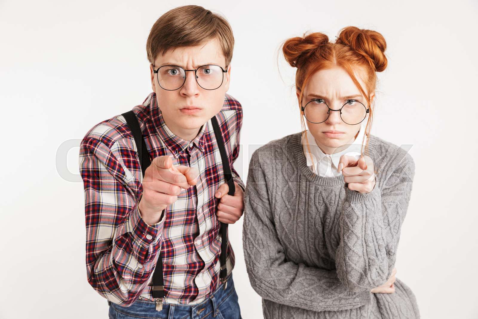 Angry couple of school nerds pointing fingers at camera | Stock image ...