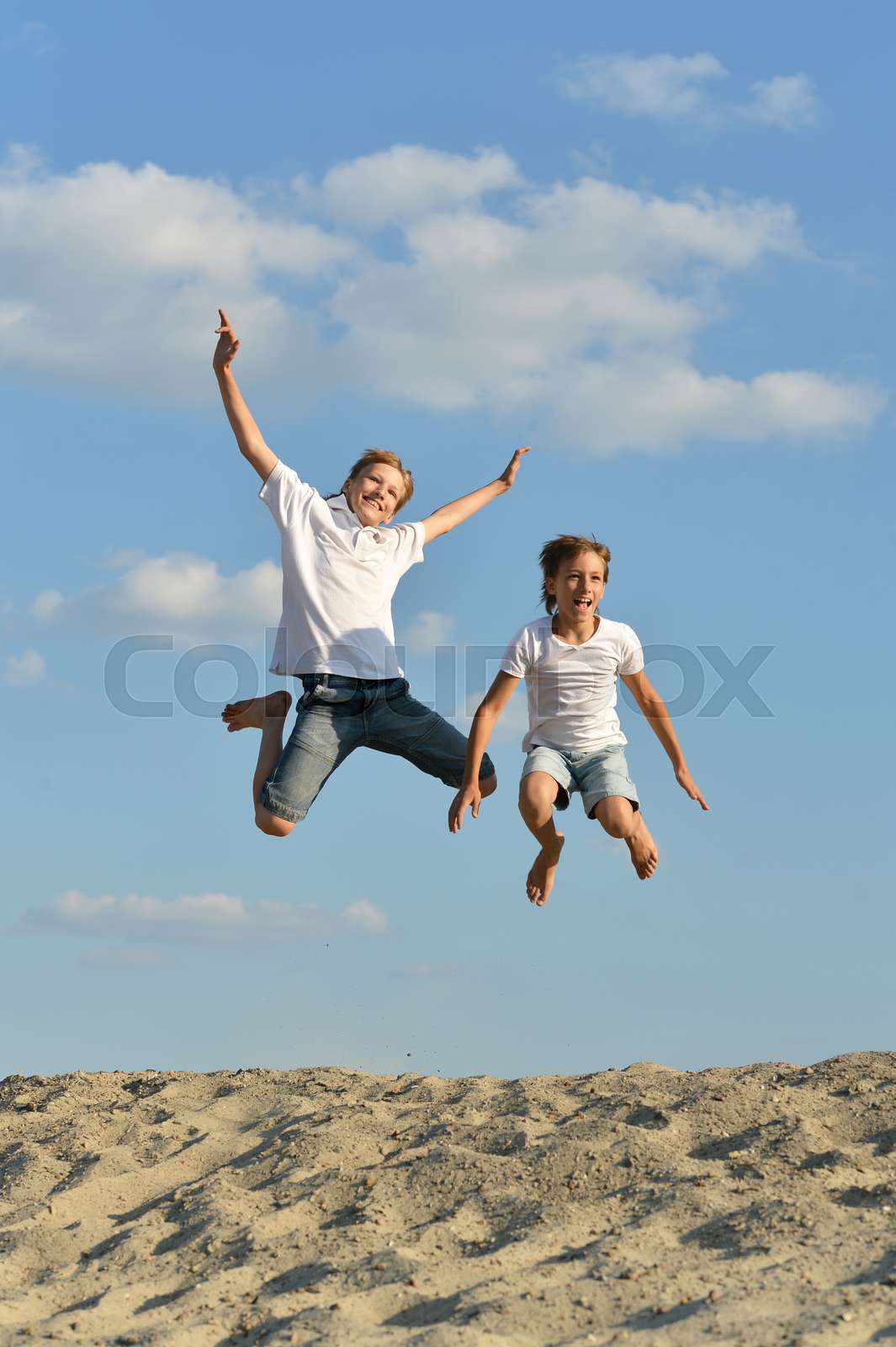 Two boys jumping | Stock image | Colourbox