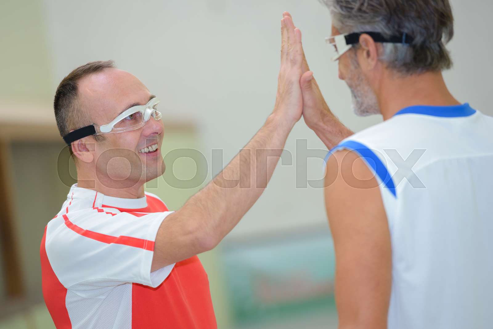 men giving high five | Stock image | Colourbox