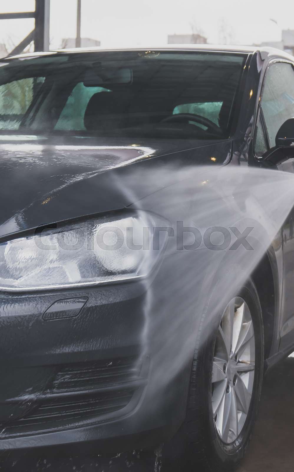 Car wash using high pressure water jet. | Stock image | Colourbox