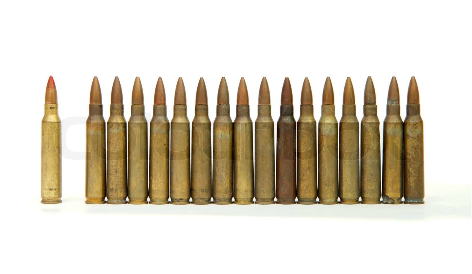 Row of standing 5.56mm M16 assault rifle cartridges isolated | Stock ...