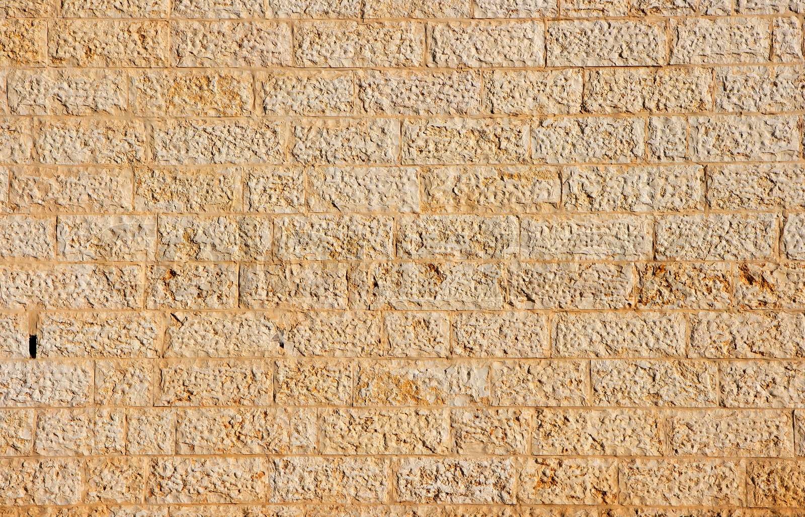 Golden mur bygget af gule sten blokke | Stock foto | Colourbox