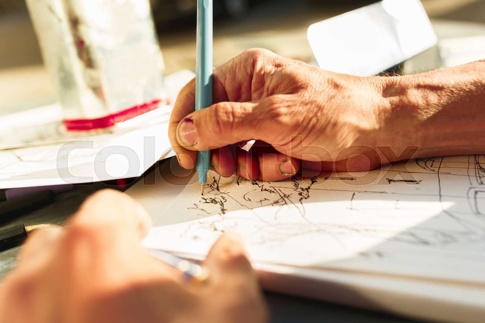 Close up man working of Architect sketching a construction project on ...