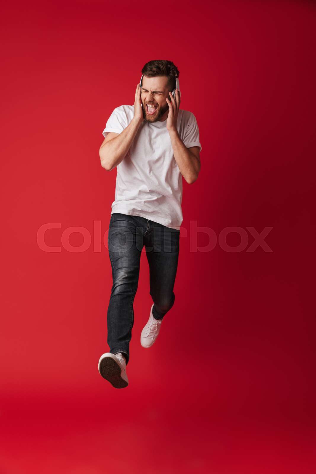 Emotional screaming young man isolated | Stock image | Colourbox