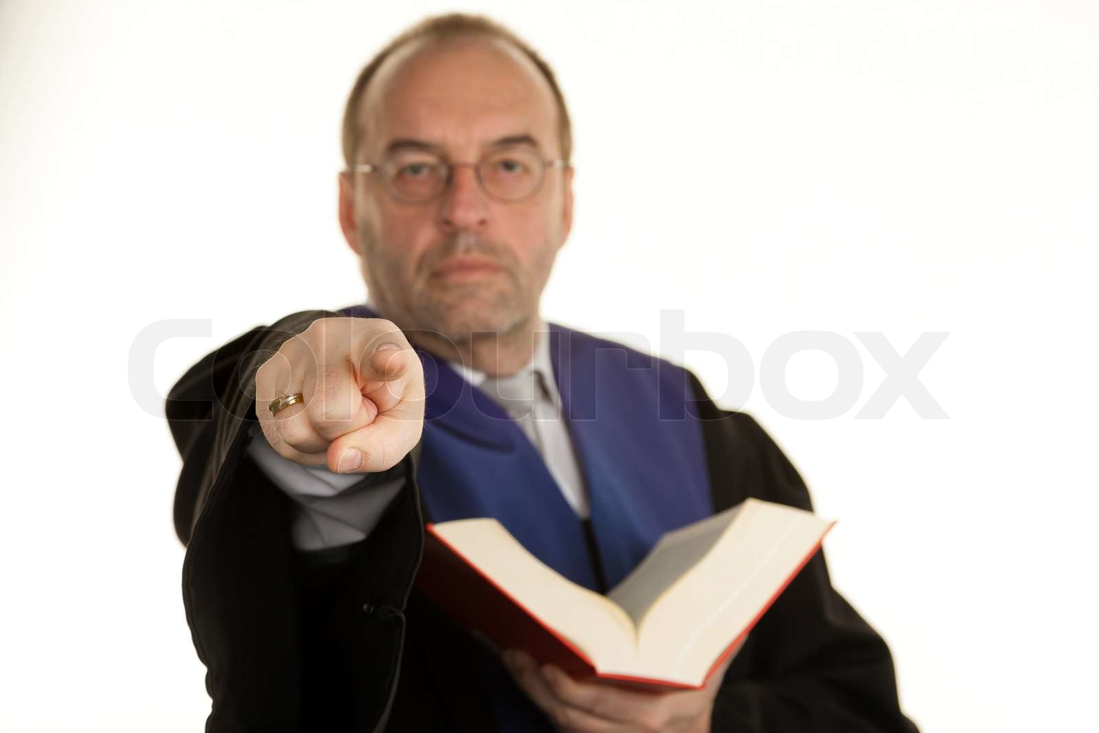 a judge with a law book in court | Stock image | Colourbox