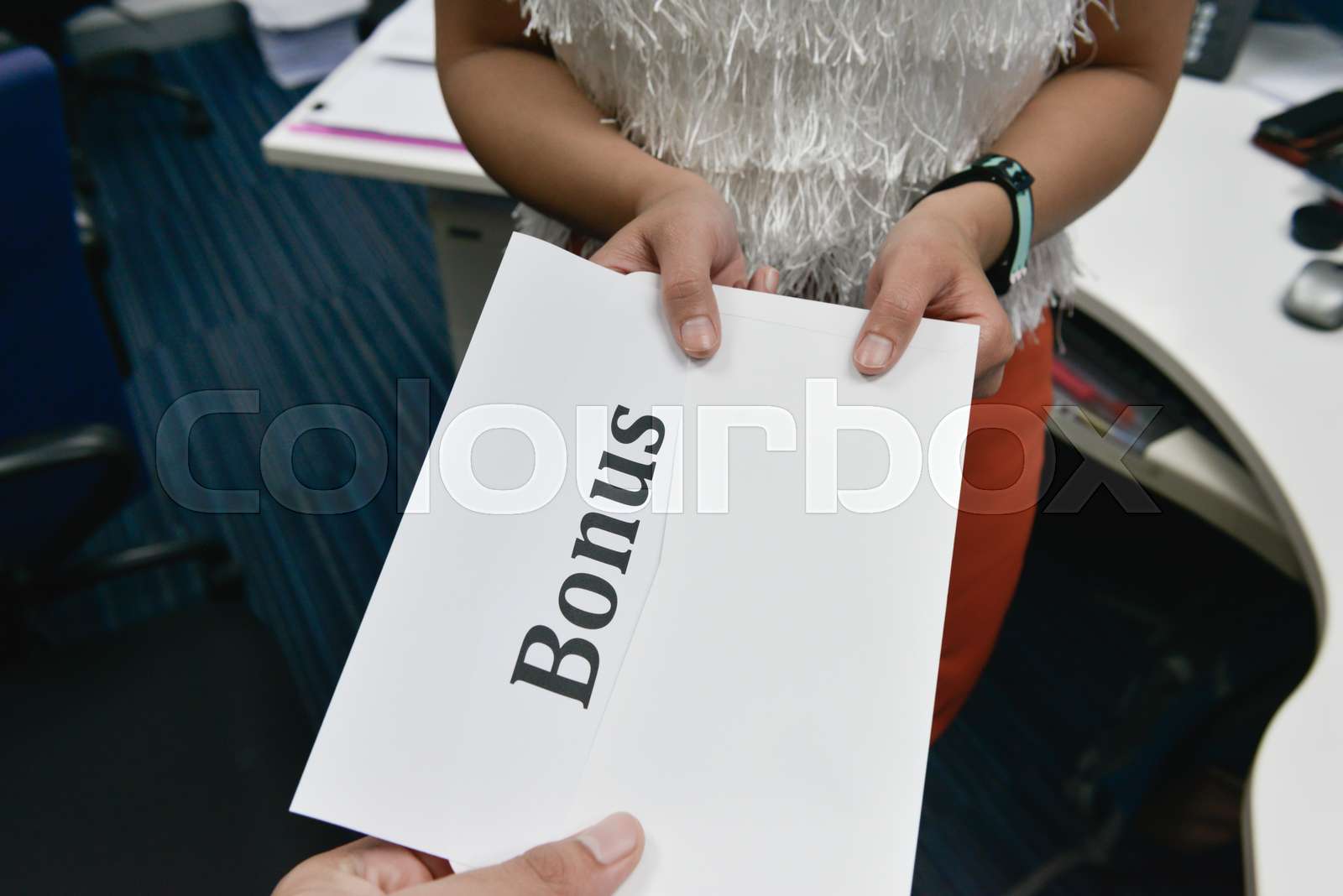 Woman hand is received the bonus in envelope | Stock image | Colourbox