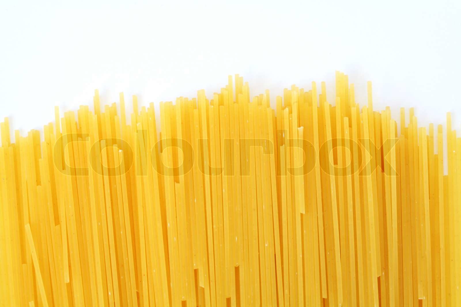 An image of spaghetti noodles in row | Stock image | Colourbox