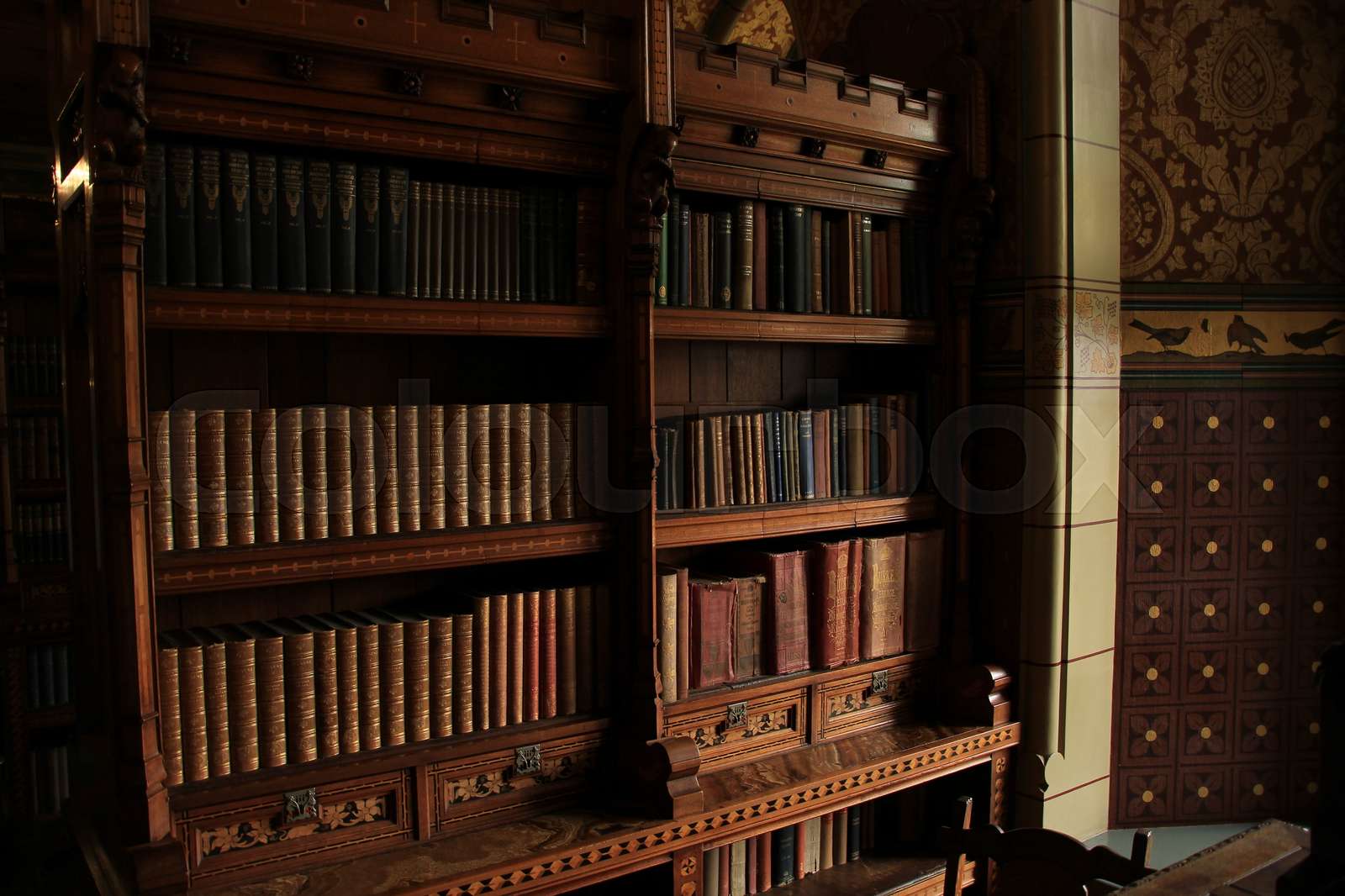 Ancient books in the bookshelf in a room in Cardiff Castle in Wales ...