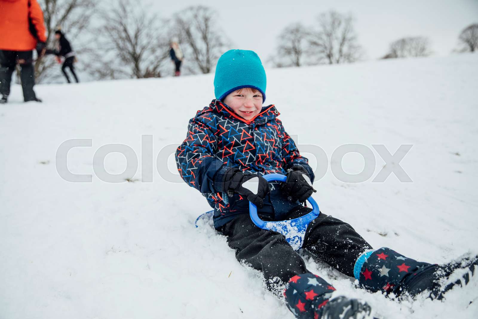Little Boy on a Sled | Stock image | Colourbox