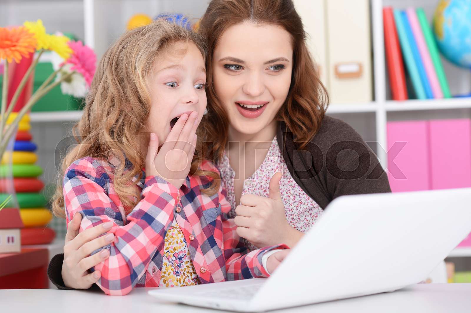 Mother And Daughter Using Laptop Stock Image Colourbox