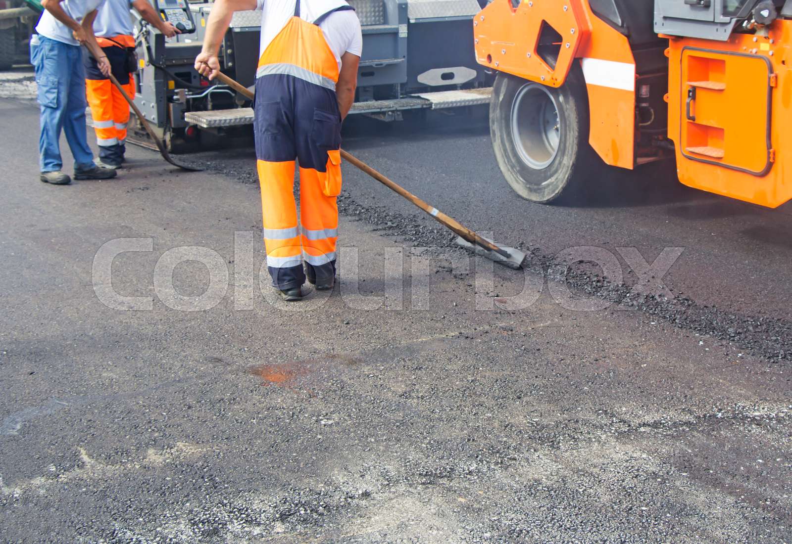 Construction workers on asphalting and road repair | Stock image ...