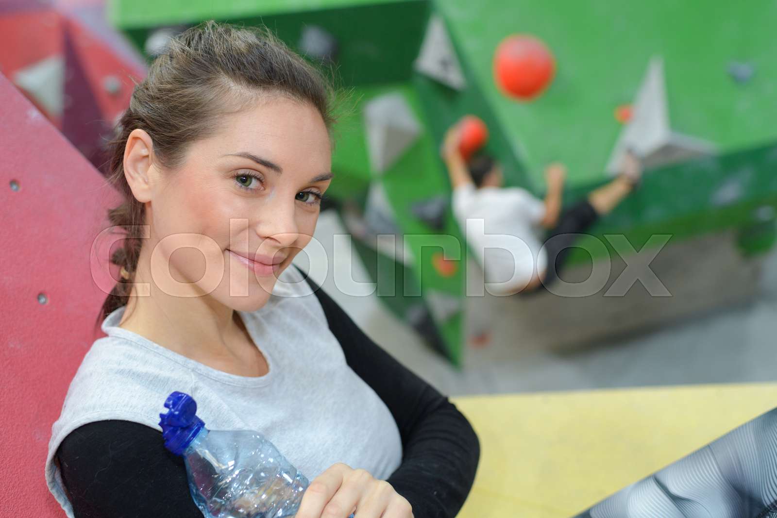 female climber posing at indoor climbing wall | Stock image | Colourbox