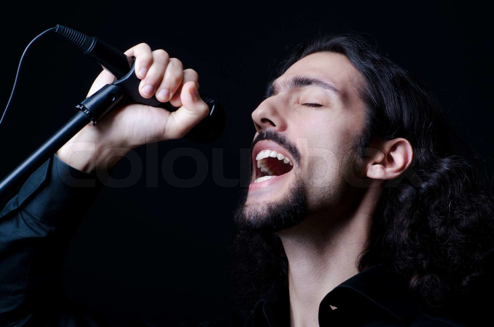 Man singing at the concert | Stock image | Colourbox
