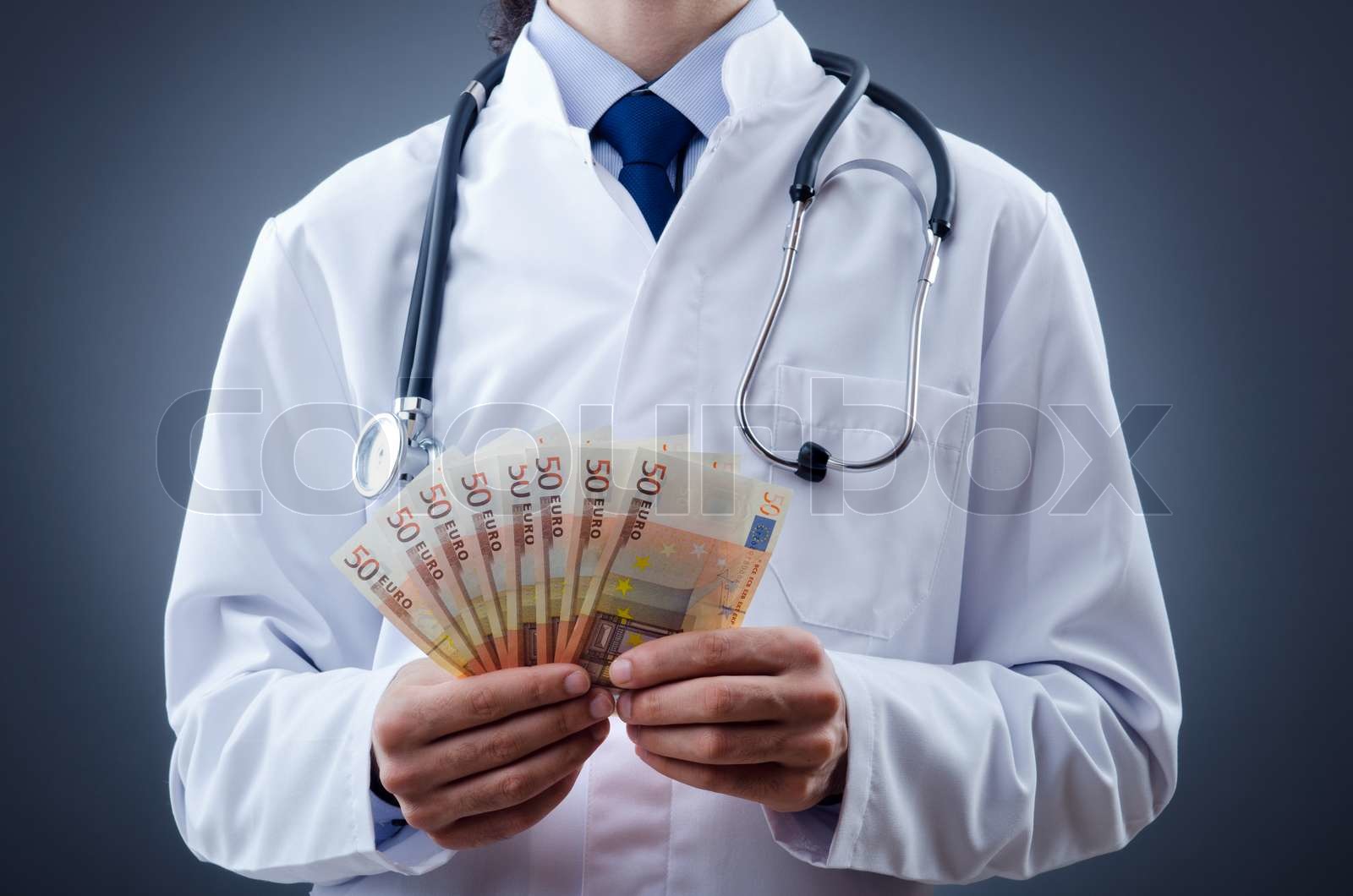 Doctor with euro money | Stock image | Colourbox