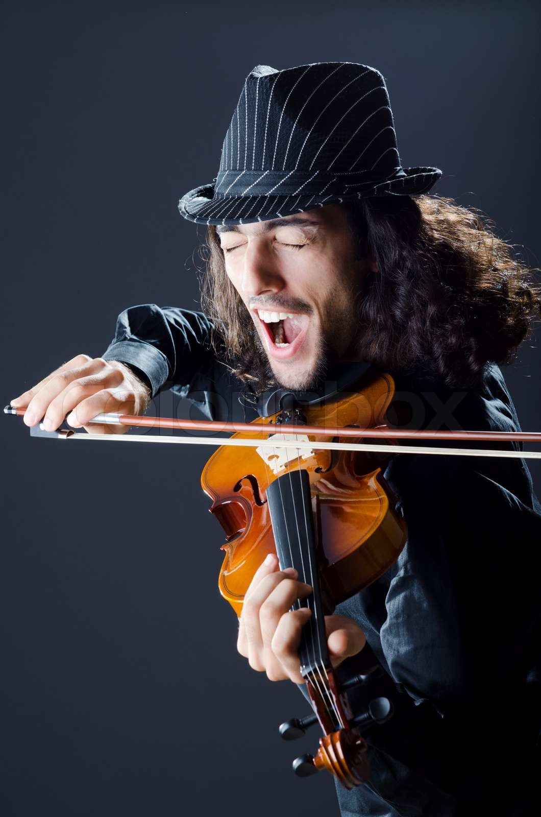 Gypsy violin player in studio | Stock image | Colourbox