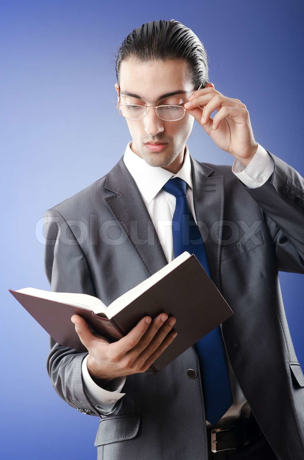 Businessman reading the book | Stock image | Colourbox