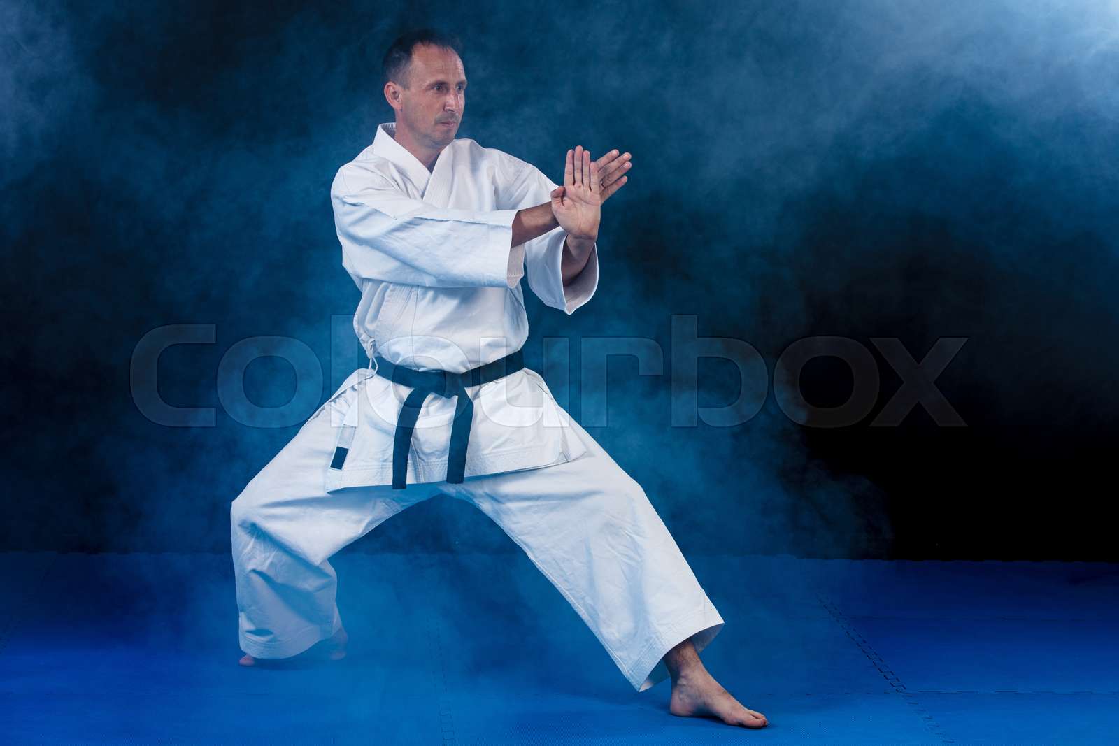 White Karate Fighter Isolated On Black with smoke effect | Stock image ...