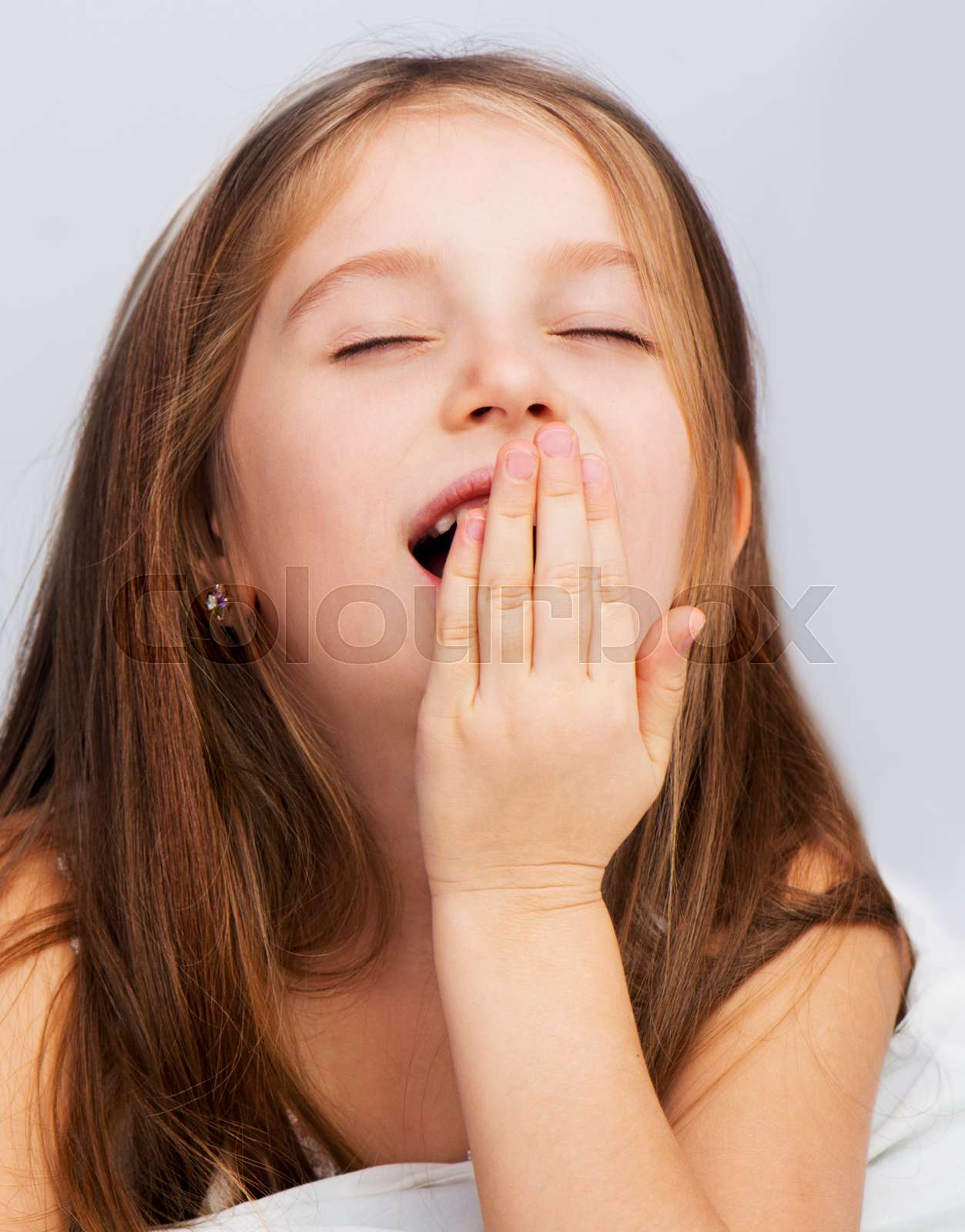 Little girl yawns | Stock image | Colourbox