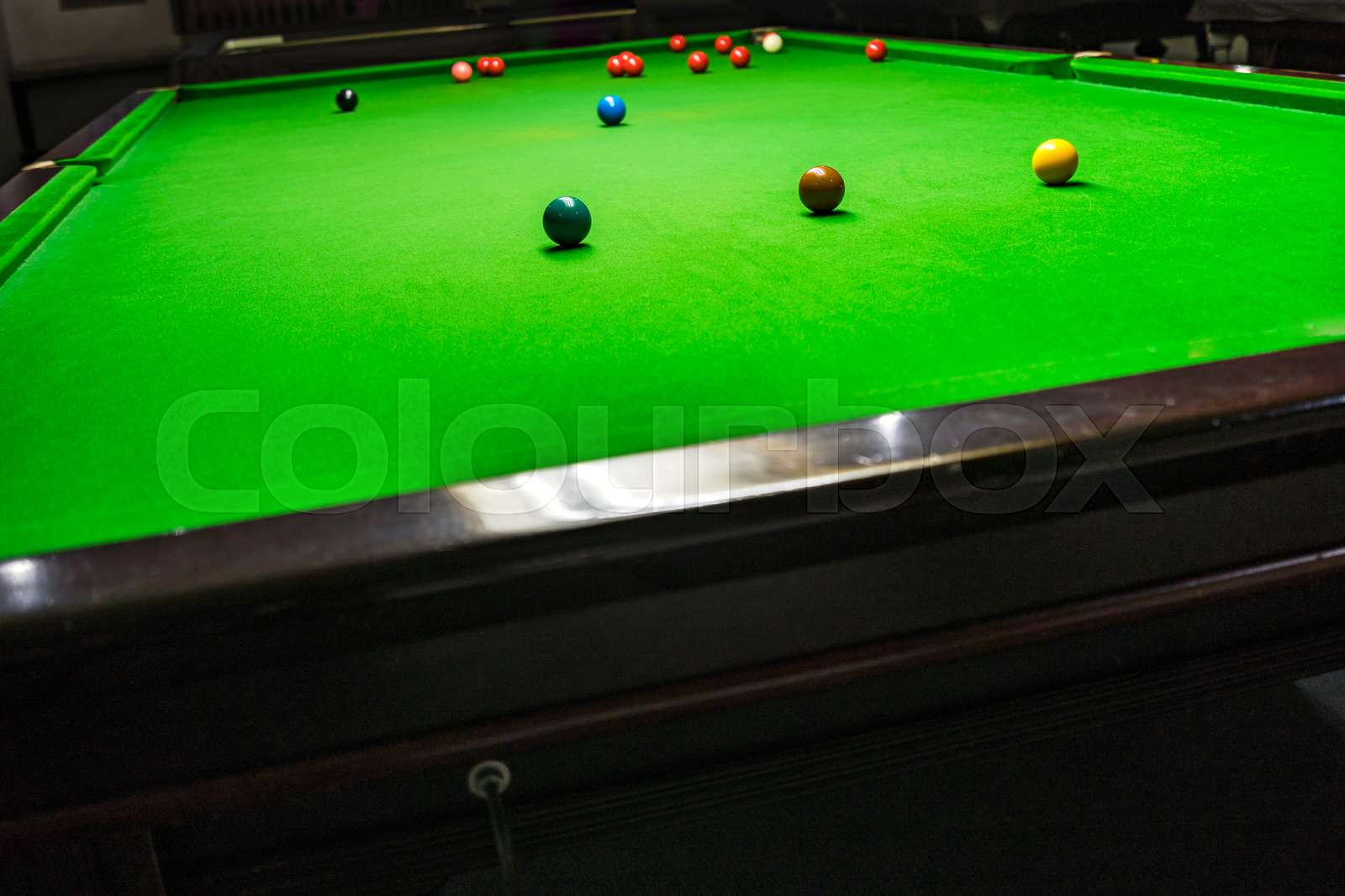 Snooker table with Multicolor snooker balls on green in the club ...