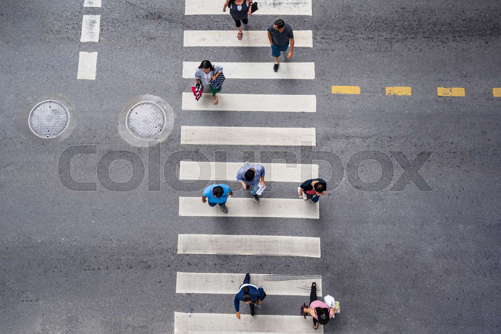 Aerial photo top view of people walk on street in the city over ...