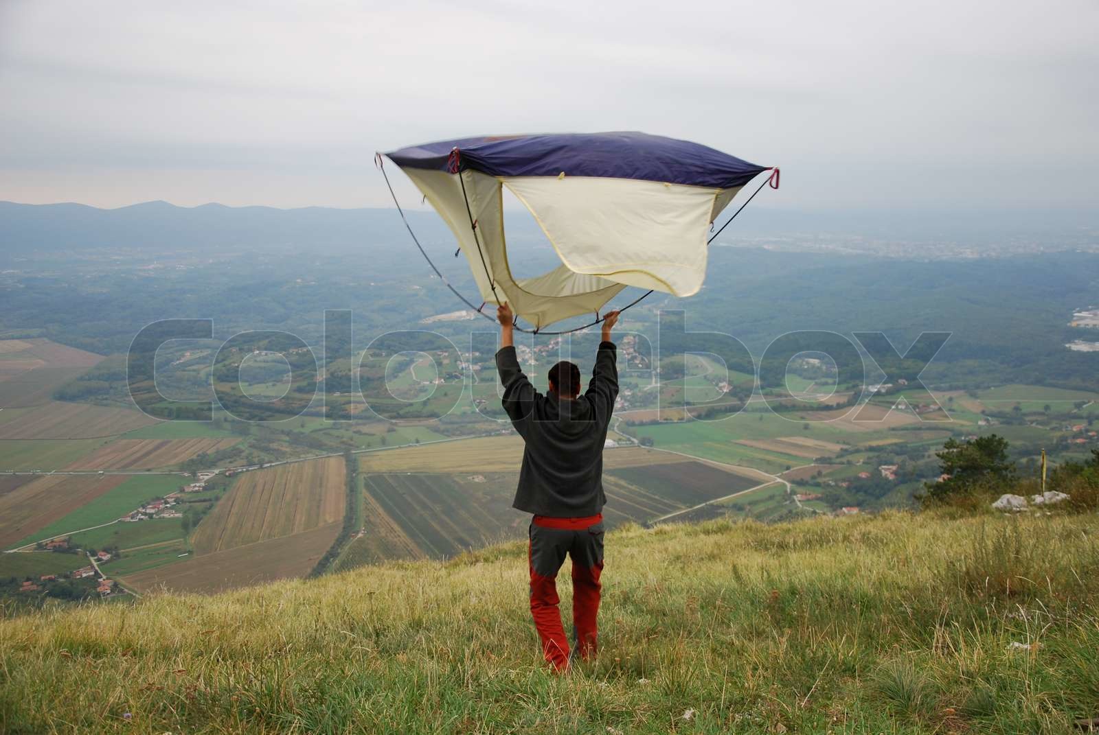 crazy paraglider starting from run way with tent glider | Stock image ...