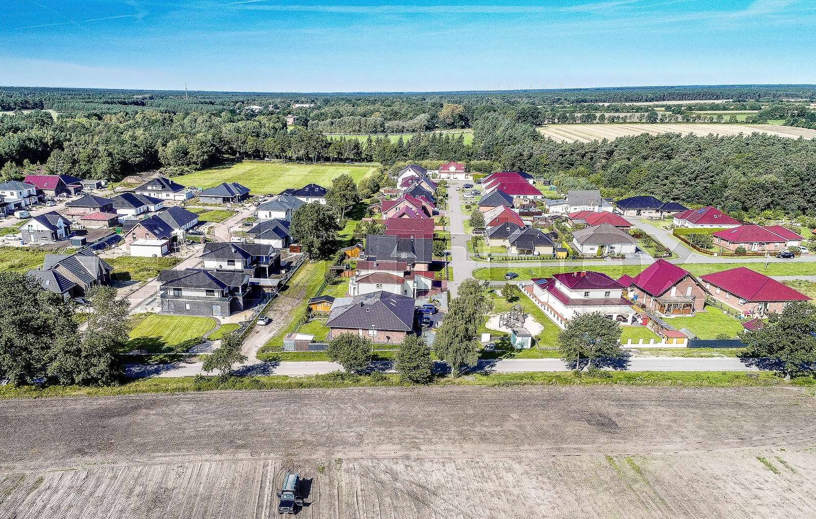 New building settlement with houses and properties with gardens, aerial ...