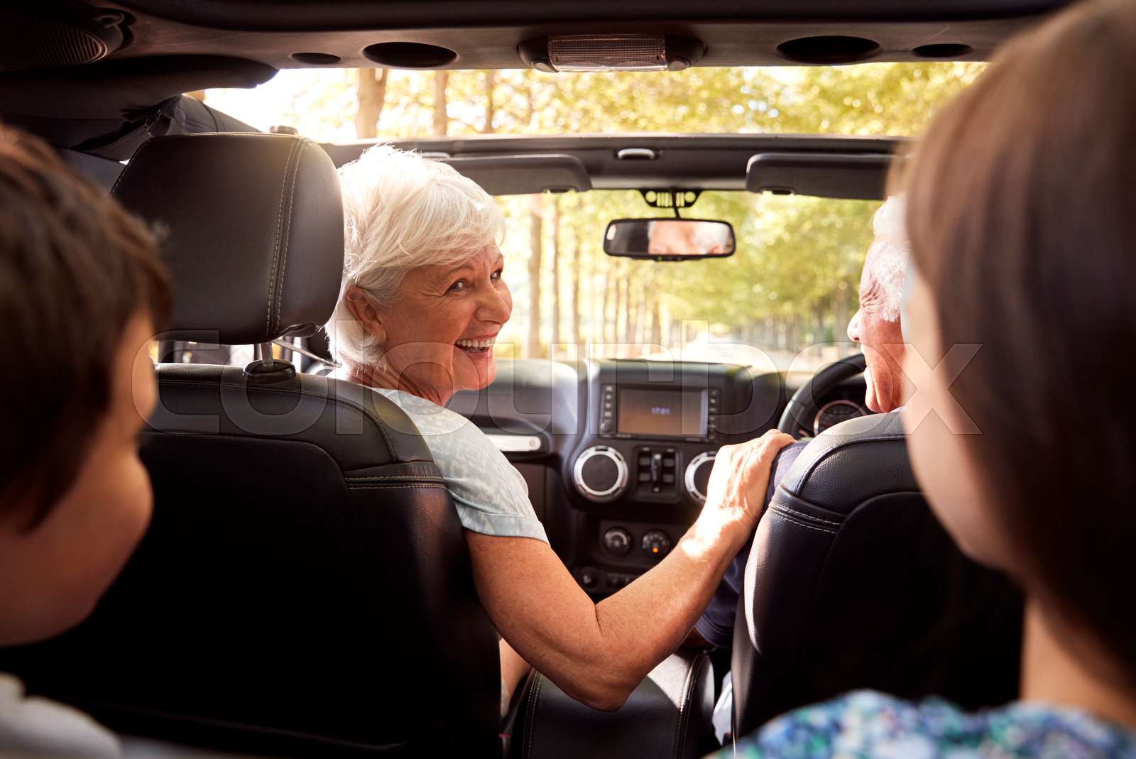 Grandparents And Grandchildren Driving In Open Top Car | Stock image ...