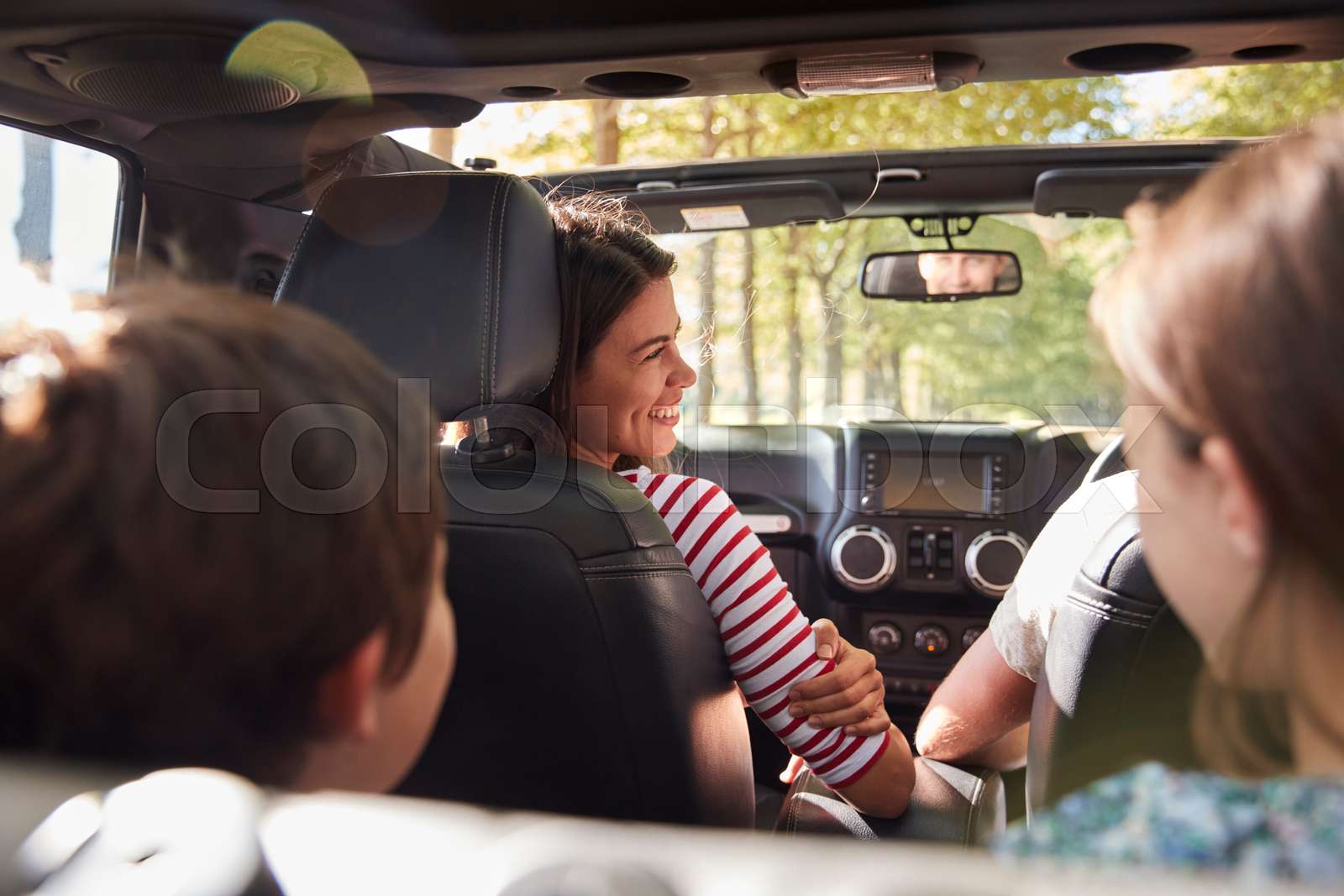 Family Driving In Open Top Car On Countryside Road Trip | Stock image ...