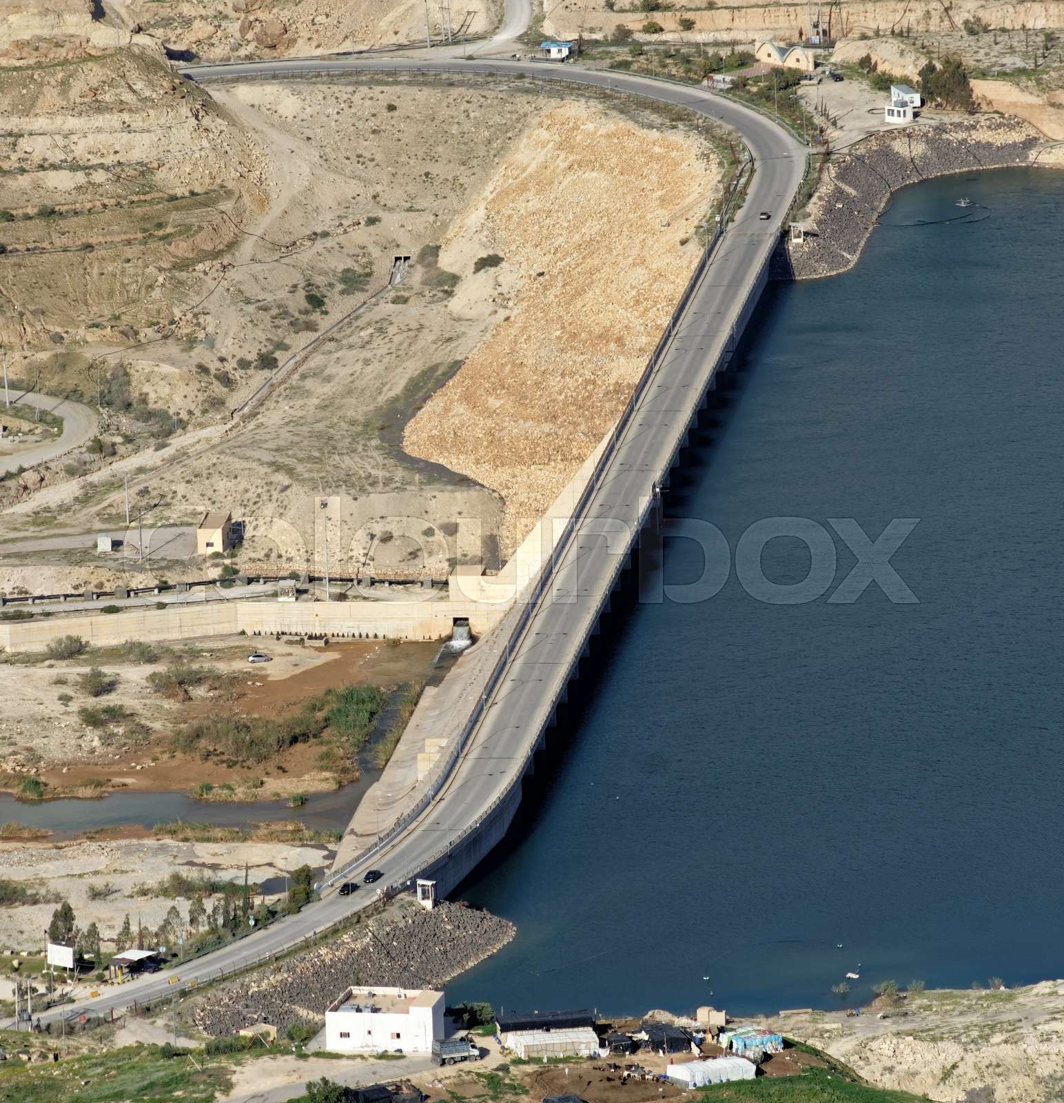 Wadi Mujib dam with a road for public transport in Jordan | Stock image ...
