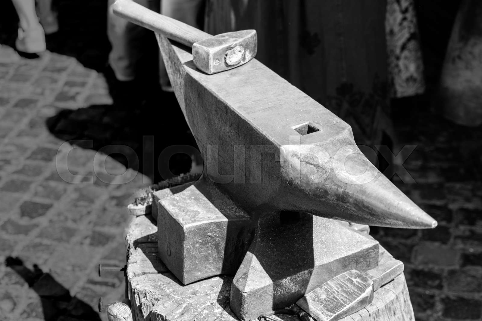 Hammer and anvil from a medieval forge in black and white | Stock image ...