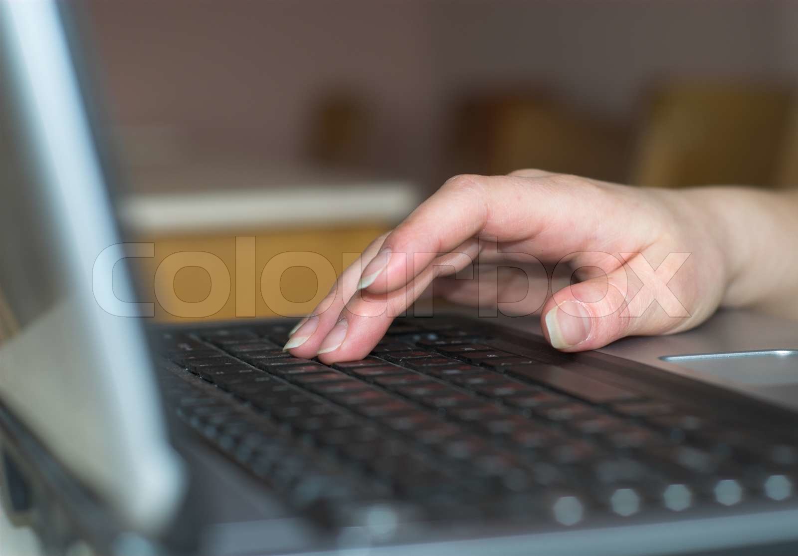 Girls' finger is pressing on laptops' keys. Fingersd in focus. | Stock ...
