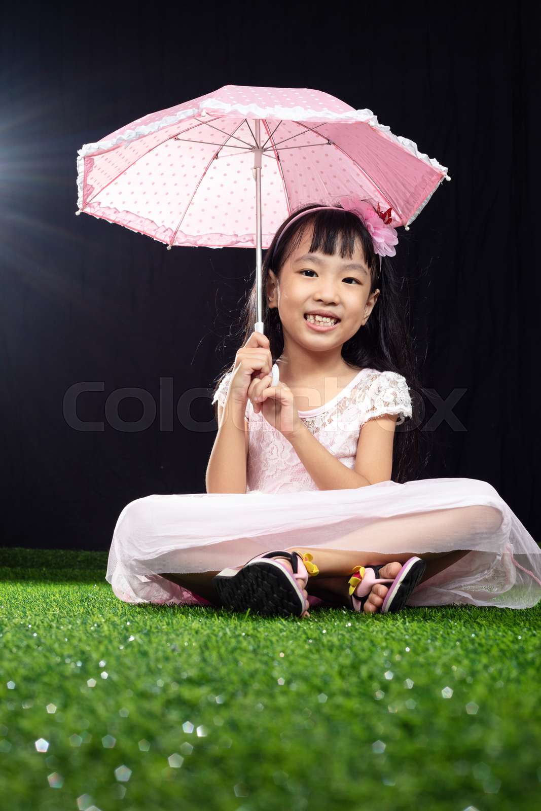 Asian Little Chinese Girl holding umbrella | Stock image | Colourbox